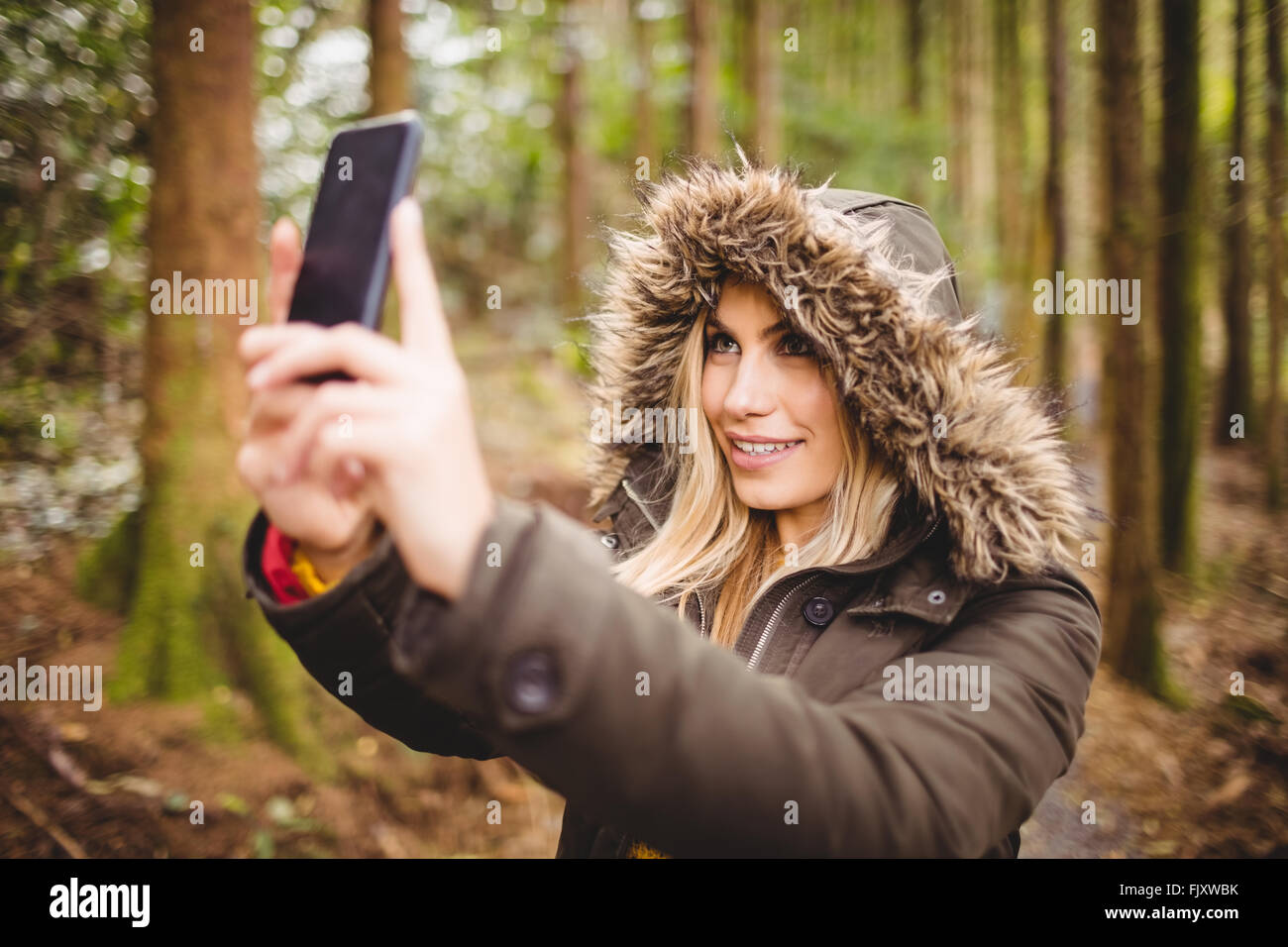 Beautiful blonde woman taking selfie hi-res stock photography and ...