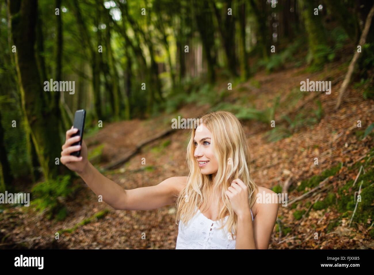 Beautiful blonde woman taking selfie hi-res stock photography and ...