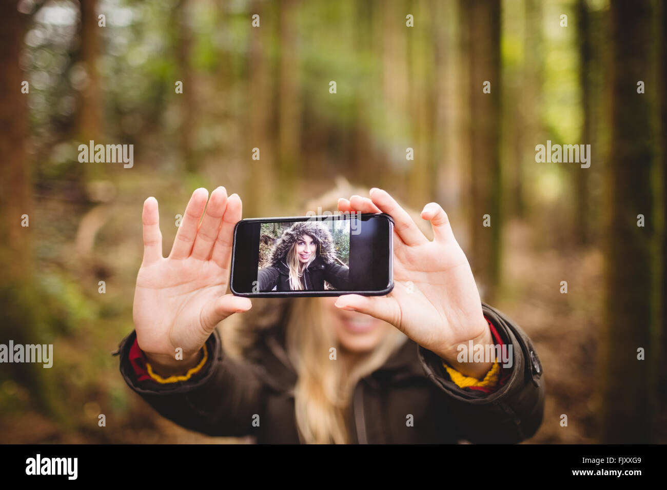 Beautiful blonde woman taking selfie hi-res stock photography and ...