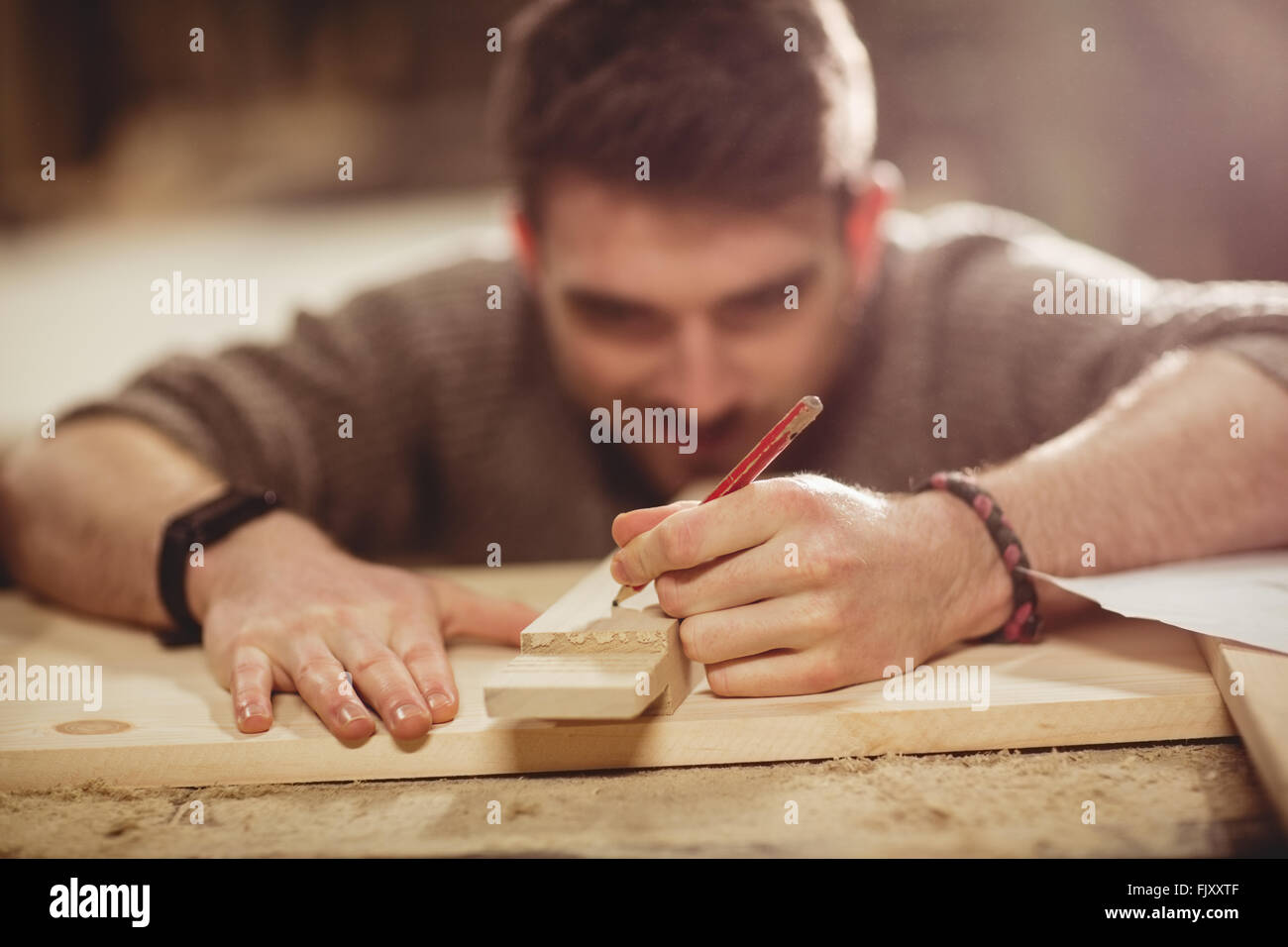 Happy carpenter working on his craft Stock Photo - Alamy