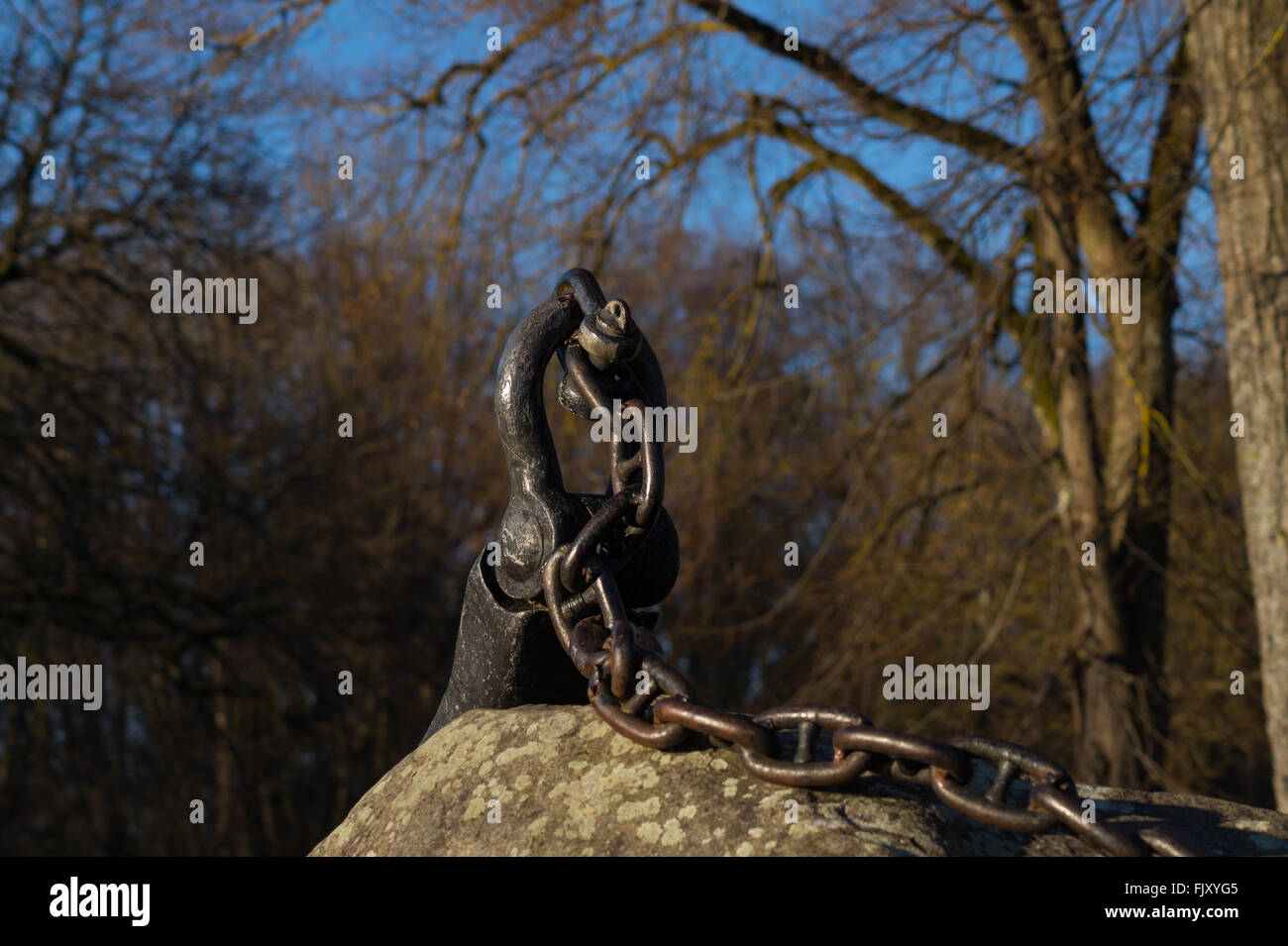 Close-Up Of Metallic Chain On Rock Stock Photo - Alamy