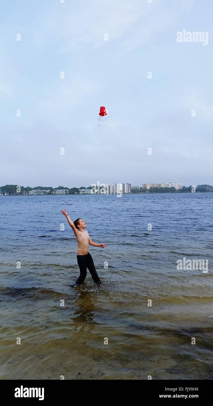 Boy Red Bucket High Resolution Stock Photography and Images - Alamy