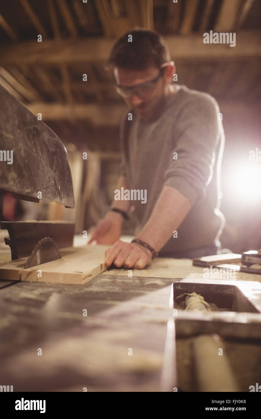 Happy carpenter working on his craft Stock Photo - Alamy