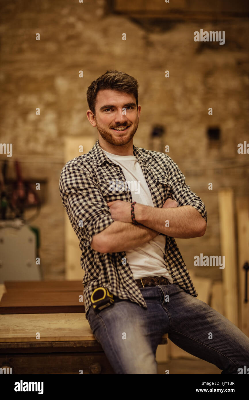 Carpenter smiling at the camera Stock Photo - Alamy