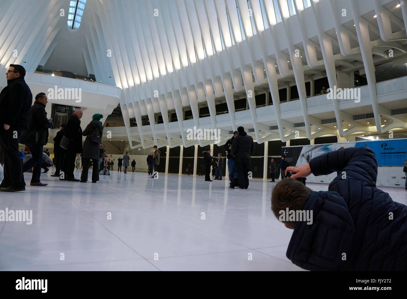 New York City, USA. 3rd March, 2016. Photographer laying on the floor ...