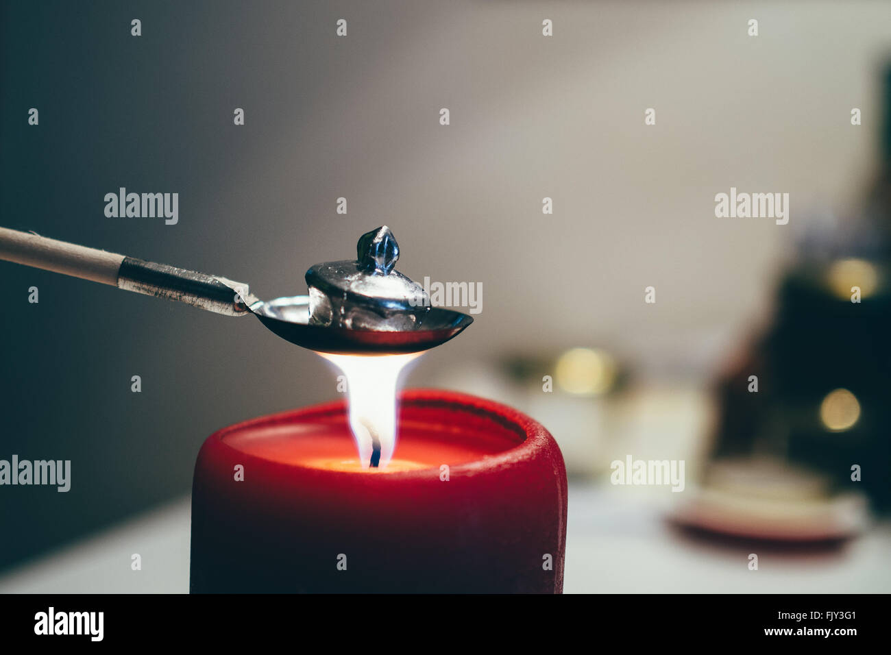 Close-Up Of Metal Being Melted By Candle Stock Photo - Alamy