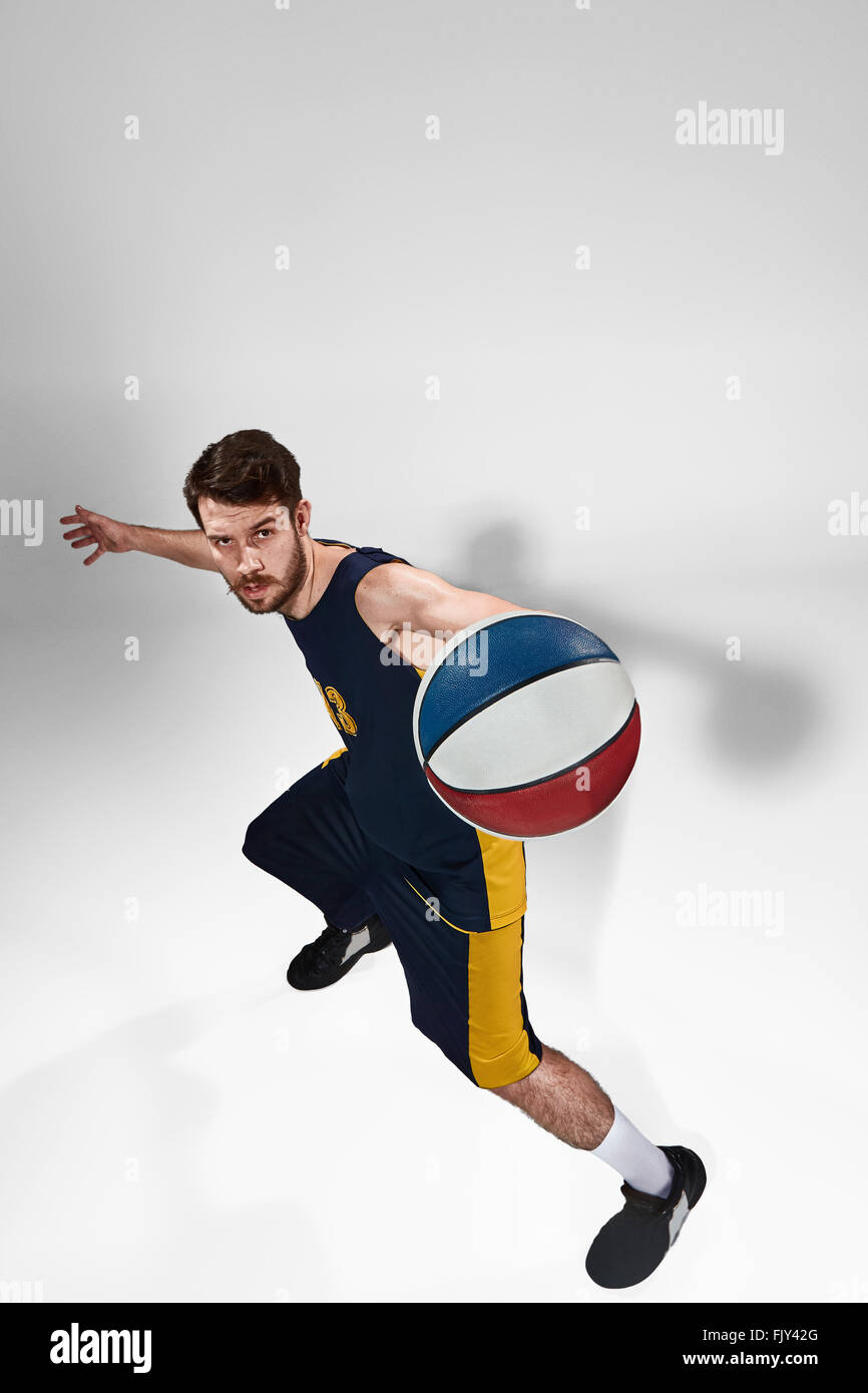 Full length portrait of a basketball player with ball Stock Photo - Alamy