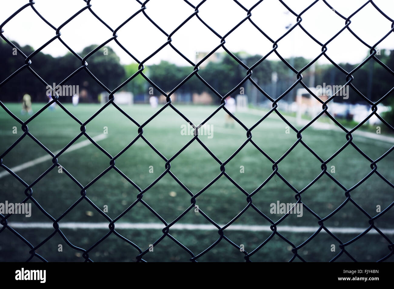 Football field with fence Stock Photo - Alamy