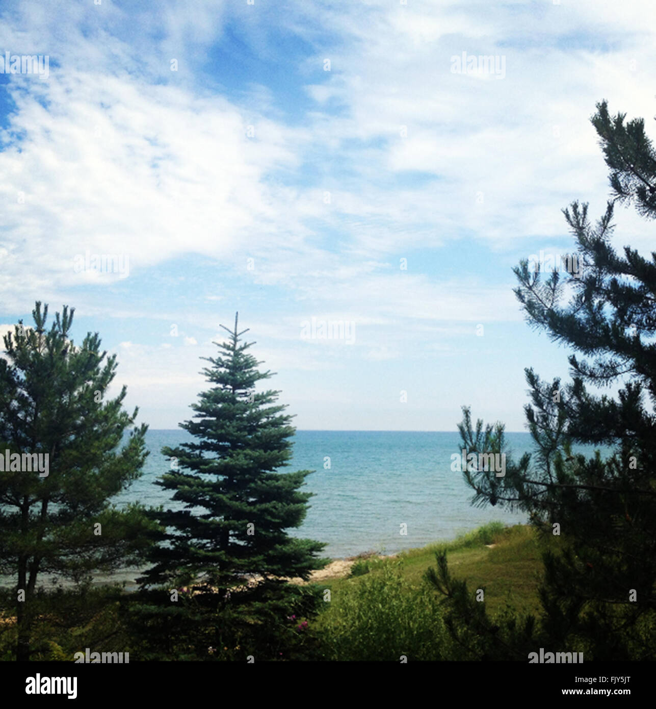 Crystal blue lake water in the summertime in Michigan Stock Photo - Alamy