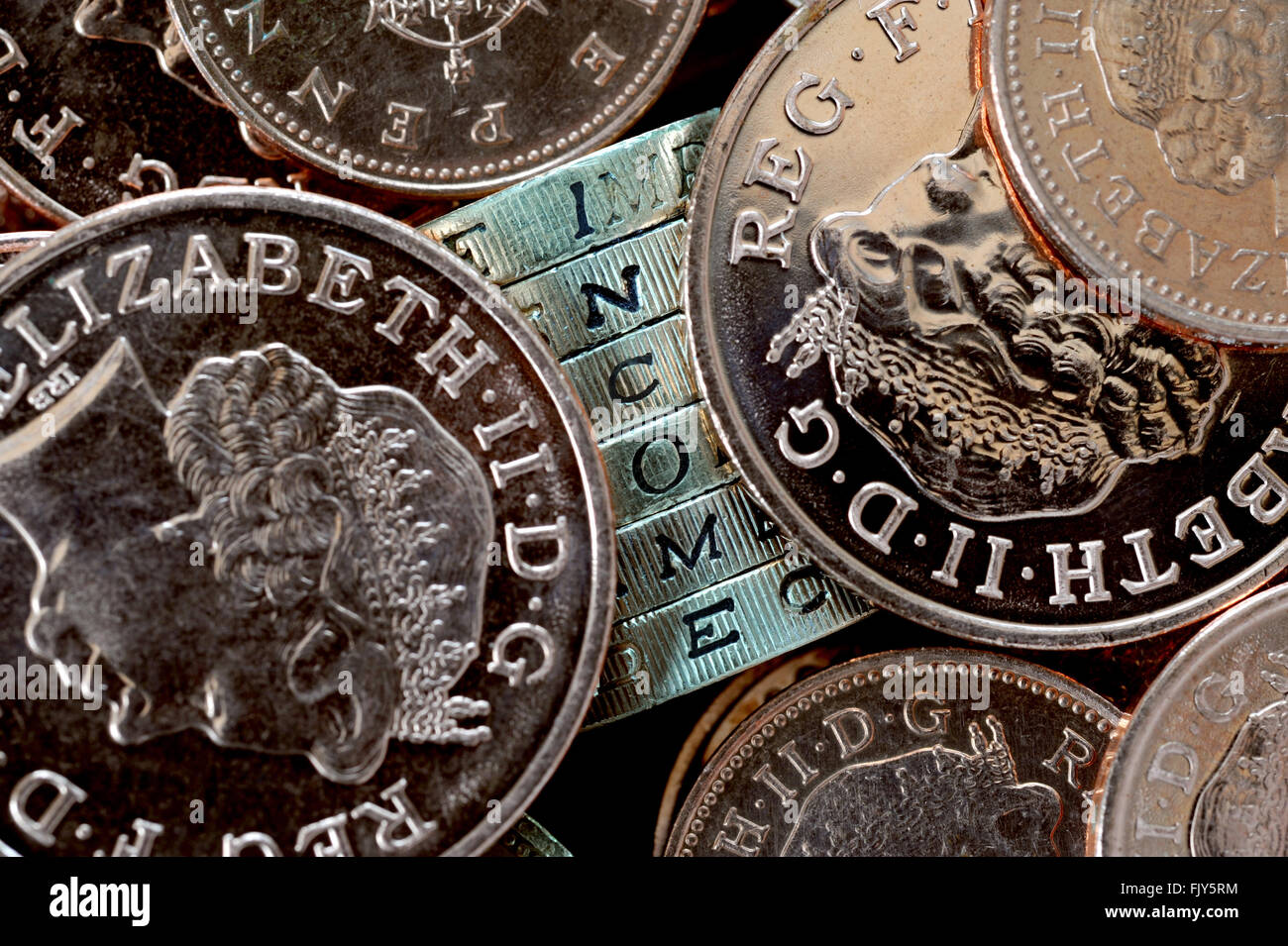 ONE POUND COIN EDGE LETTERS SPELLING WORD "INCOME" WITH OTHER COINS RE ...