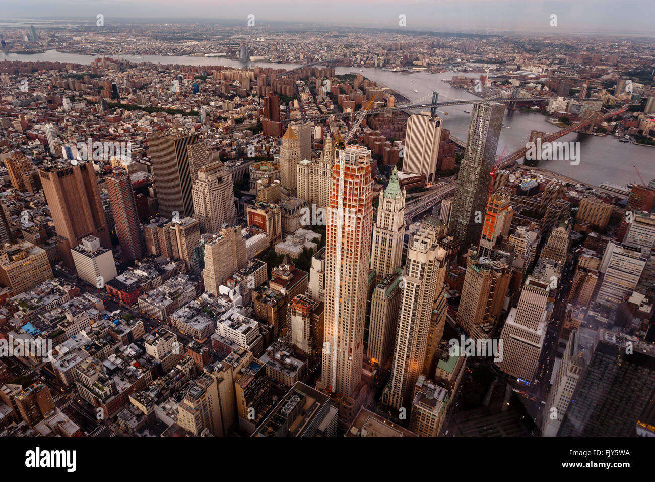 Aerial view of east side of Manhattan and Brooklyn showing variety of ...