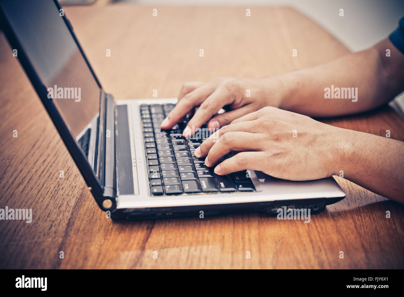 using a laptop computer in office Stock Photo - Alamy