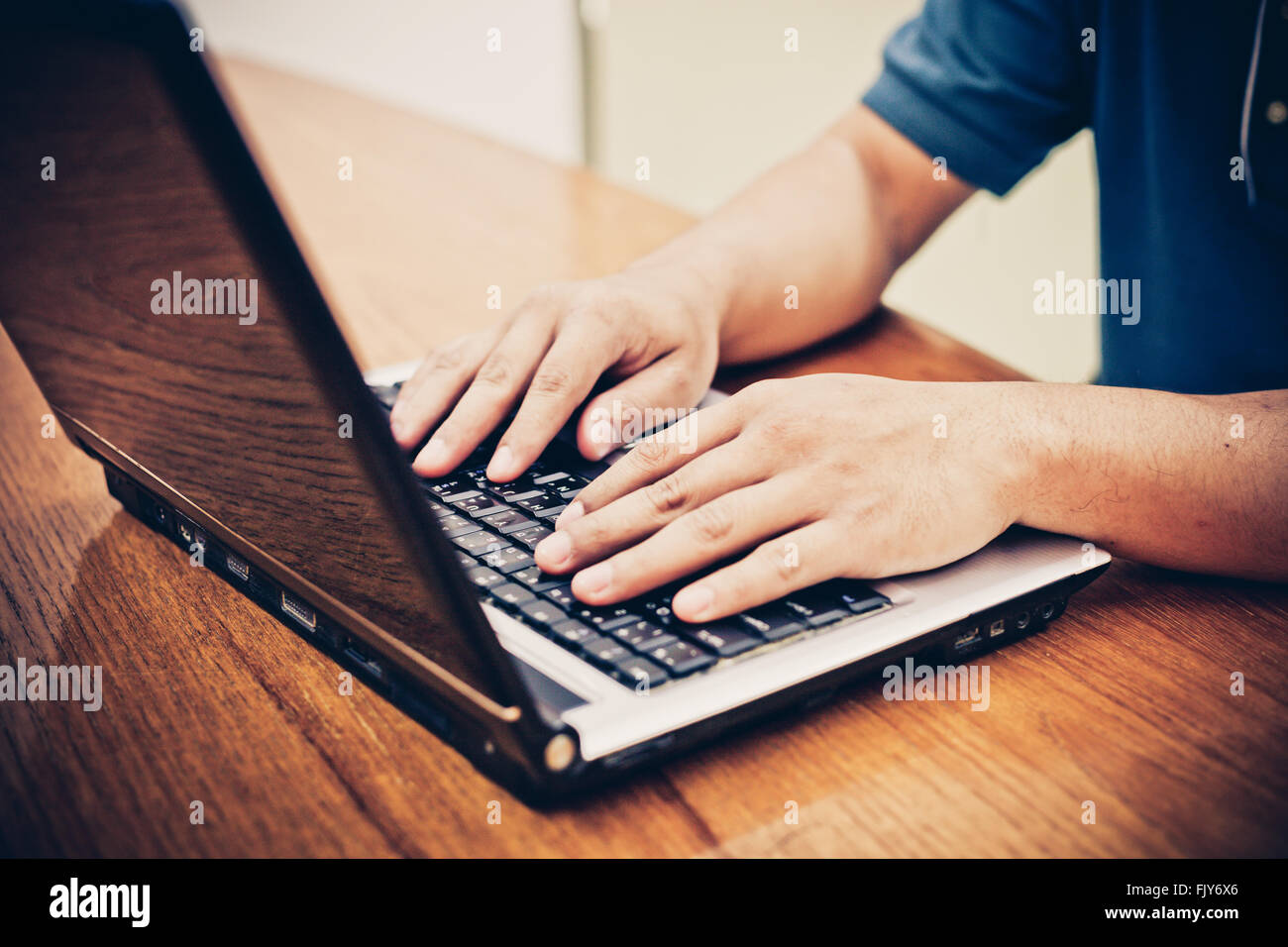 using a laptop computer in office Stock Photo - Alamy