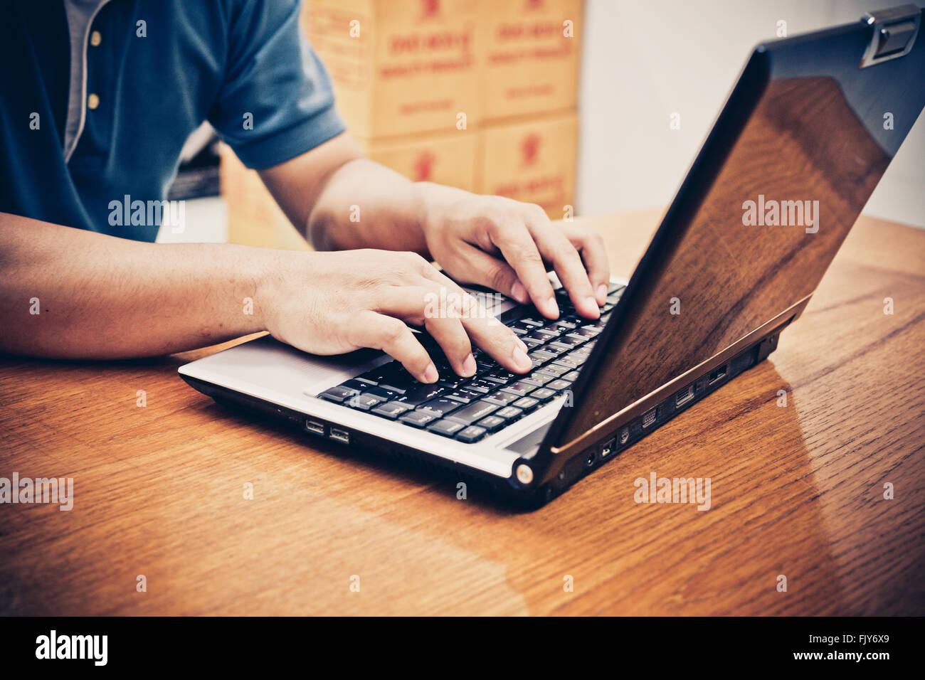 using a laptop computer in office Stock Photo - Alamy
