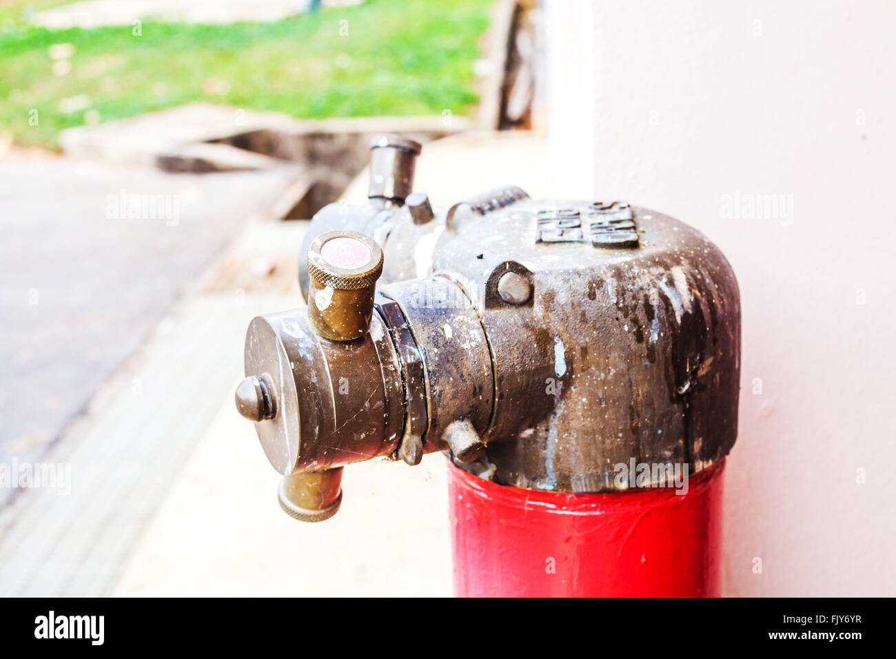 Fire Hydrant on the building Stock Photo - Alamy