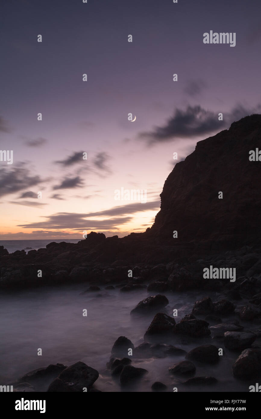 Moonset and sunset at Crescent Bay beach in Laguna Beach, California ...