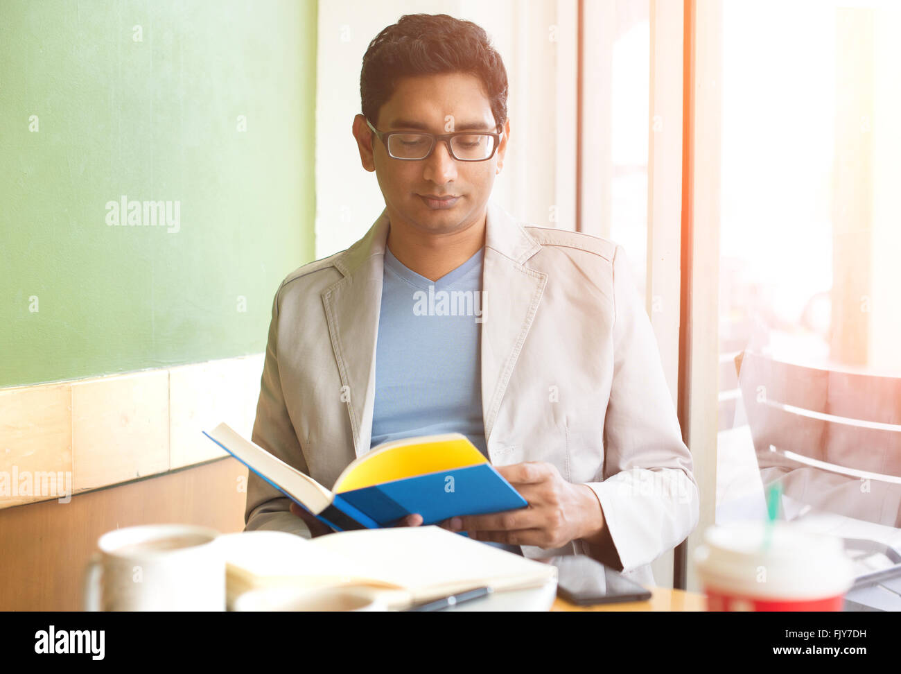 Attractive indian man read hi-res stock photography and images - Alamy