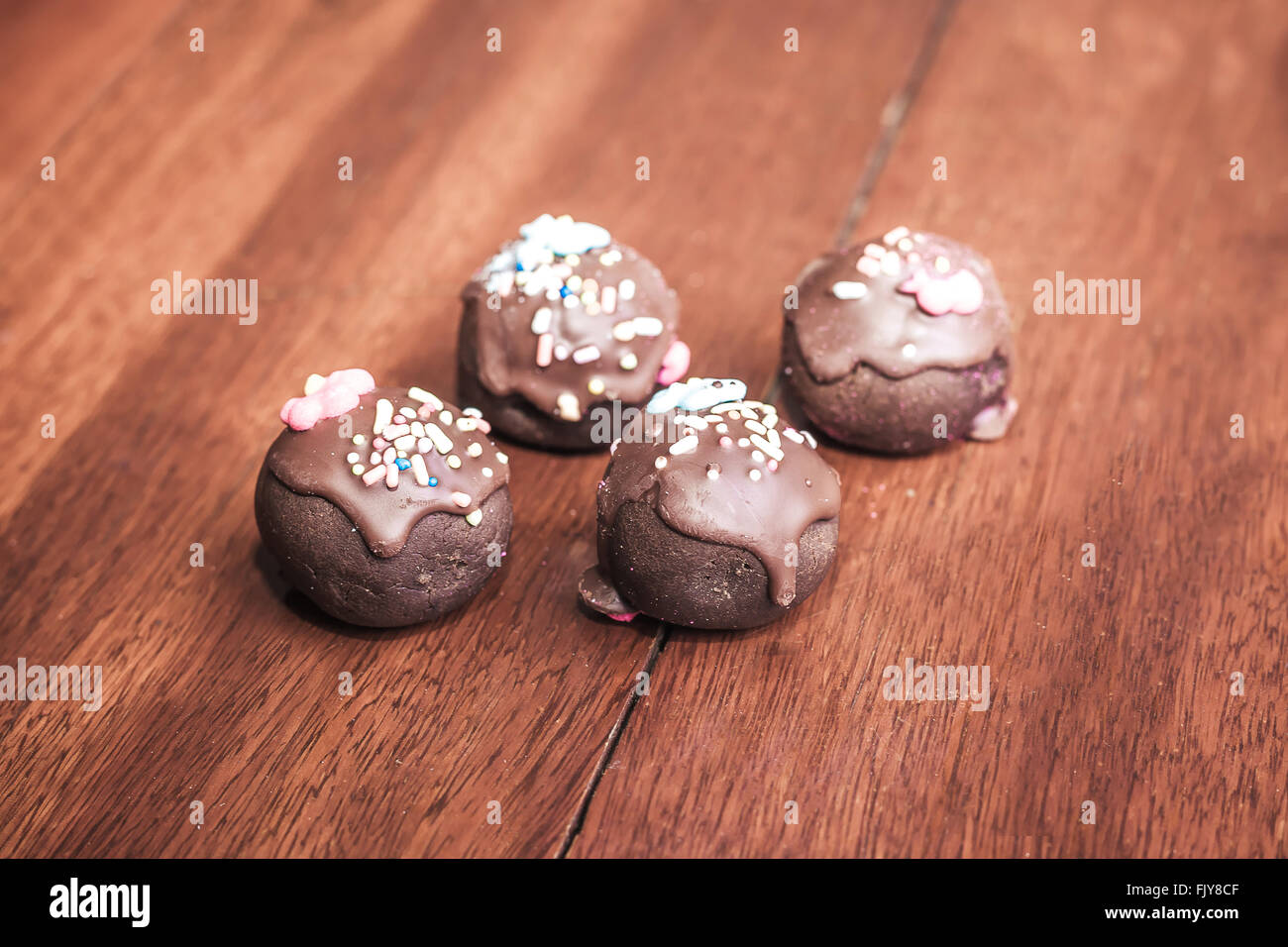 Chocolate balls topping with a sugar resin. Vintage color tone Stock ...