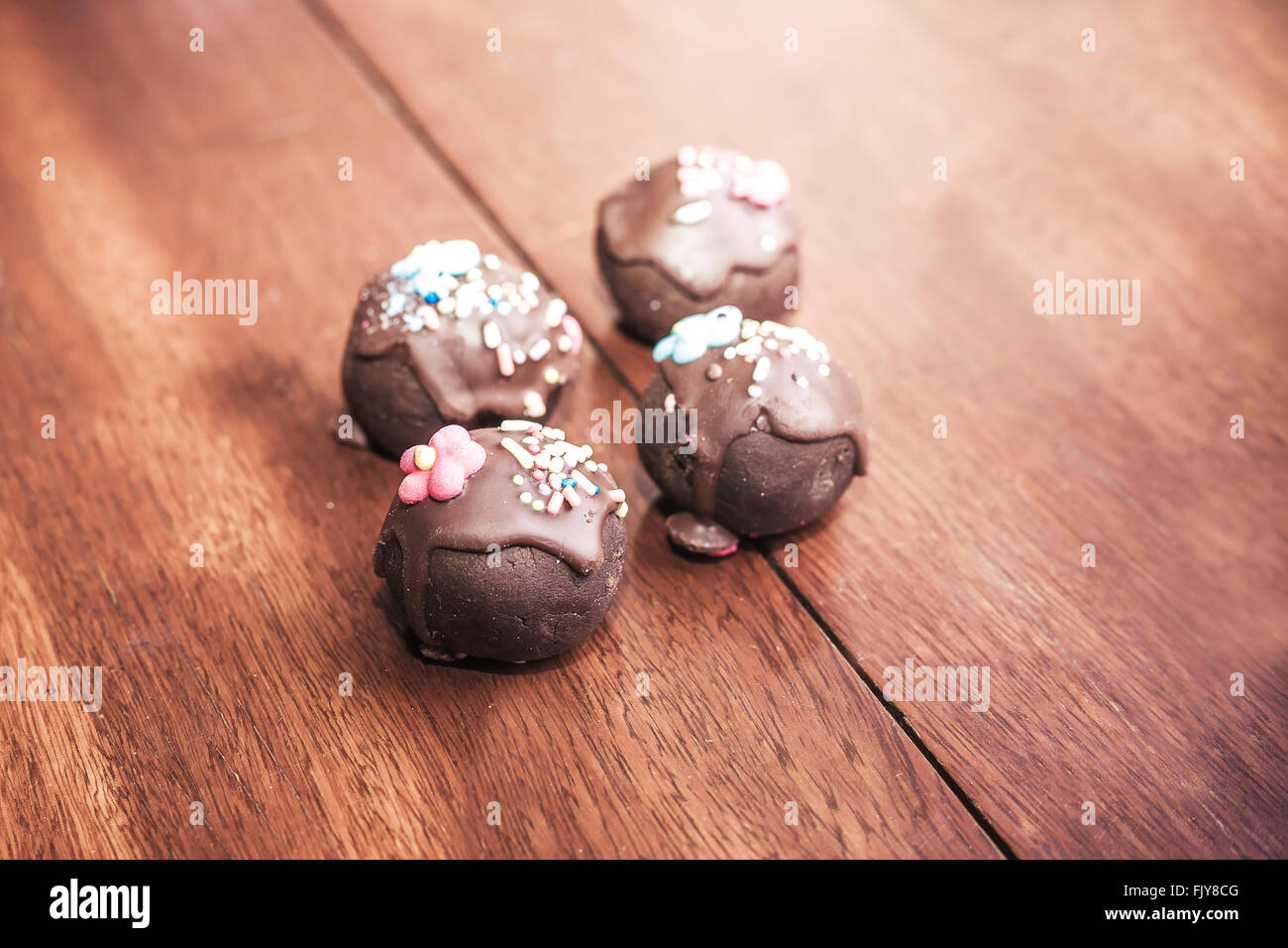 Chocolate balls topping with a sugar resin. Vintage color tone Stock ...