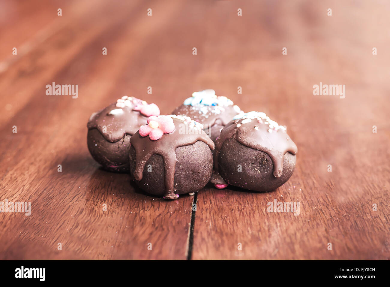 Chocolate balls topping with a sugar resin. Vintage color tone Stock ...