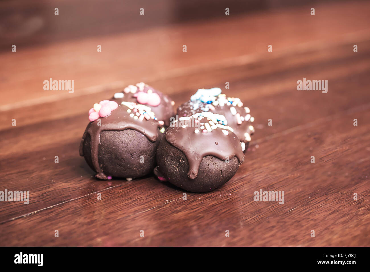Chocolate balls topping with a sugar resin. Vintage color tone Stock ...