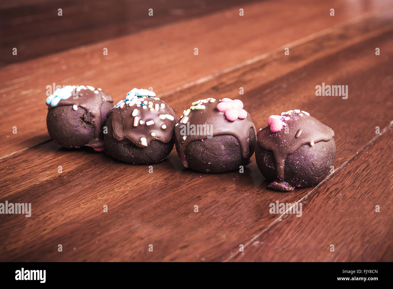 Chocolate balls topping with a sugar resin. Vintage color tone Stock ...