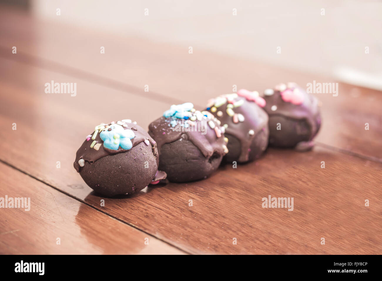 Chocolate balls topping with a sugar resin. Vintage color tone Stock ...