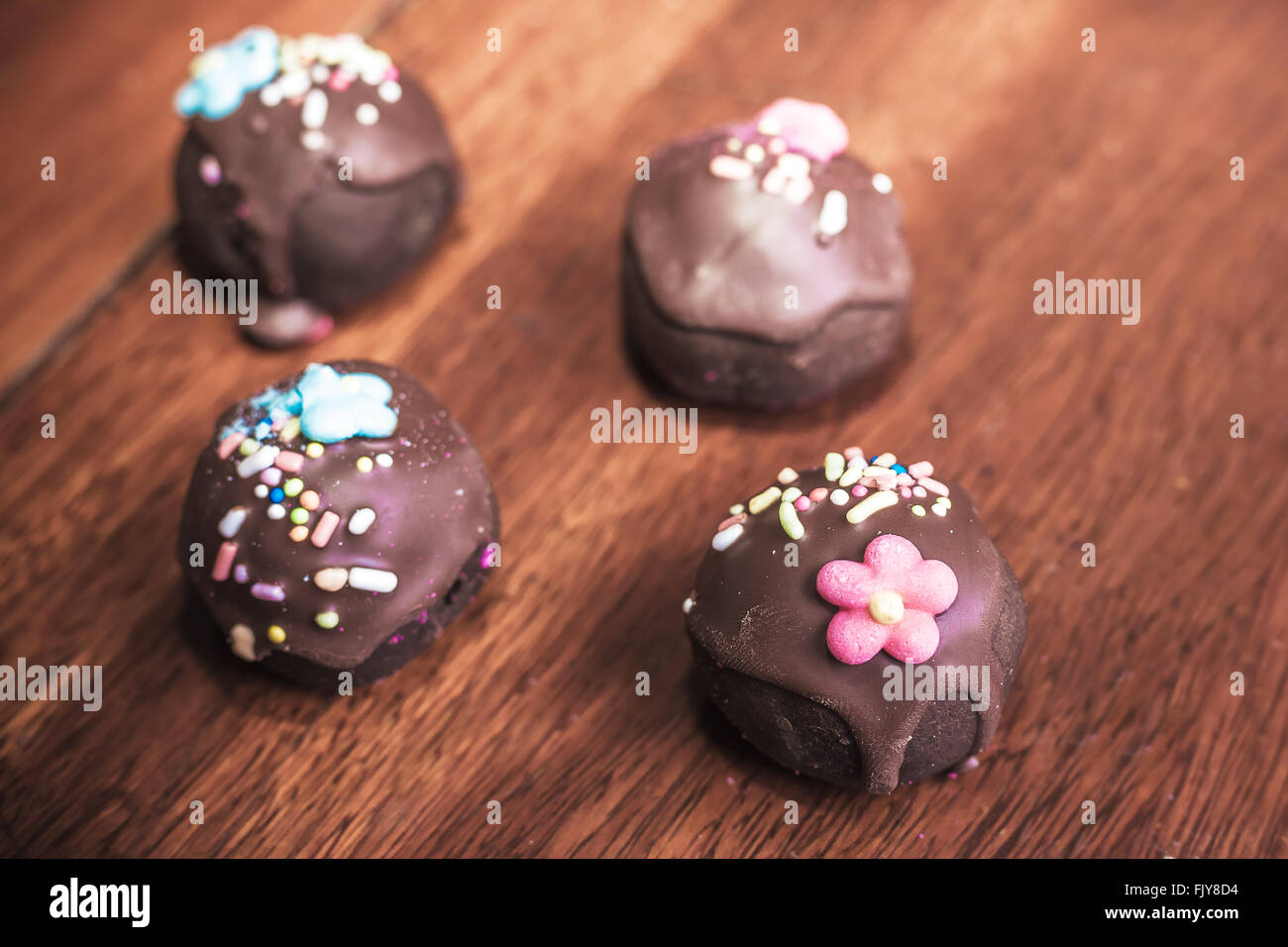 Chocolate balls topping with a sugar resin. Vintage color tone Stock ...