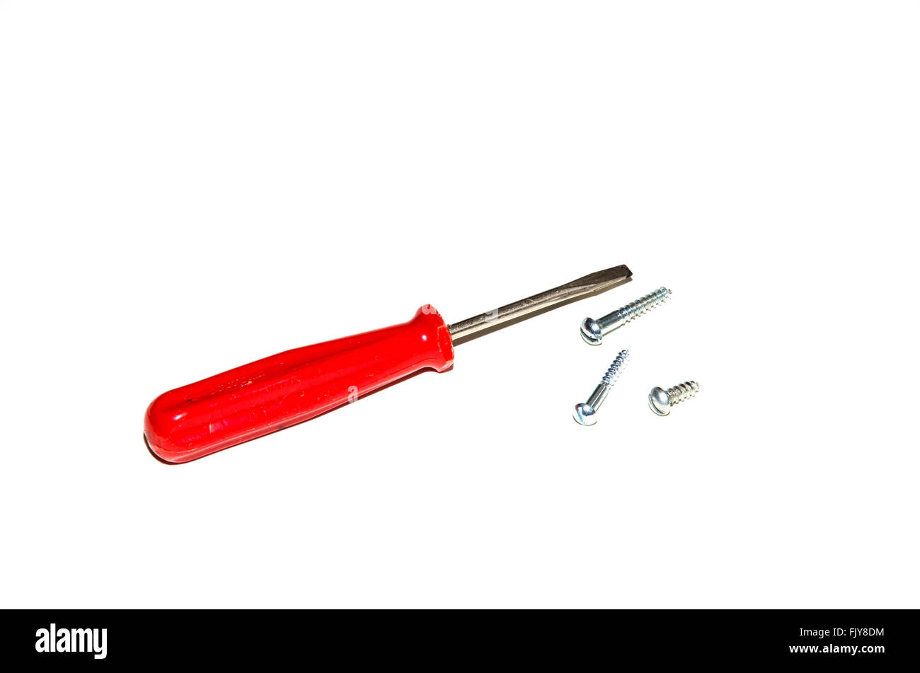 Red screwdriver with screws at a white background Stock Photo - Alamy