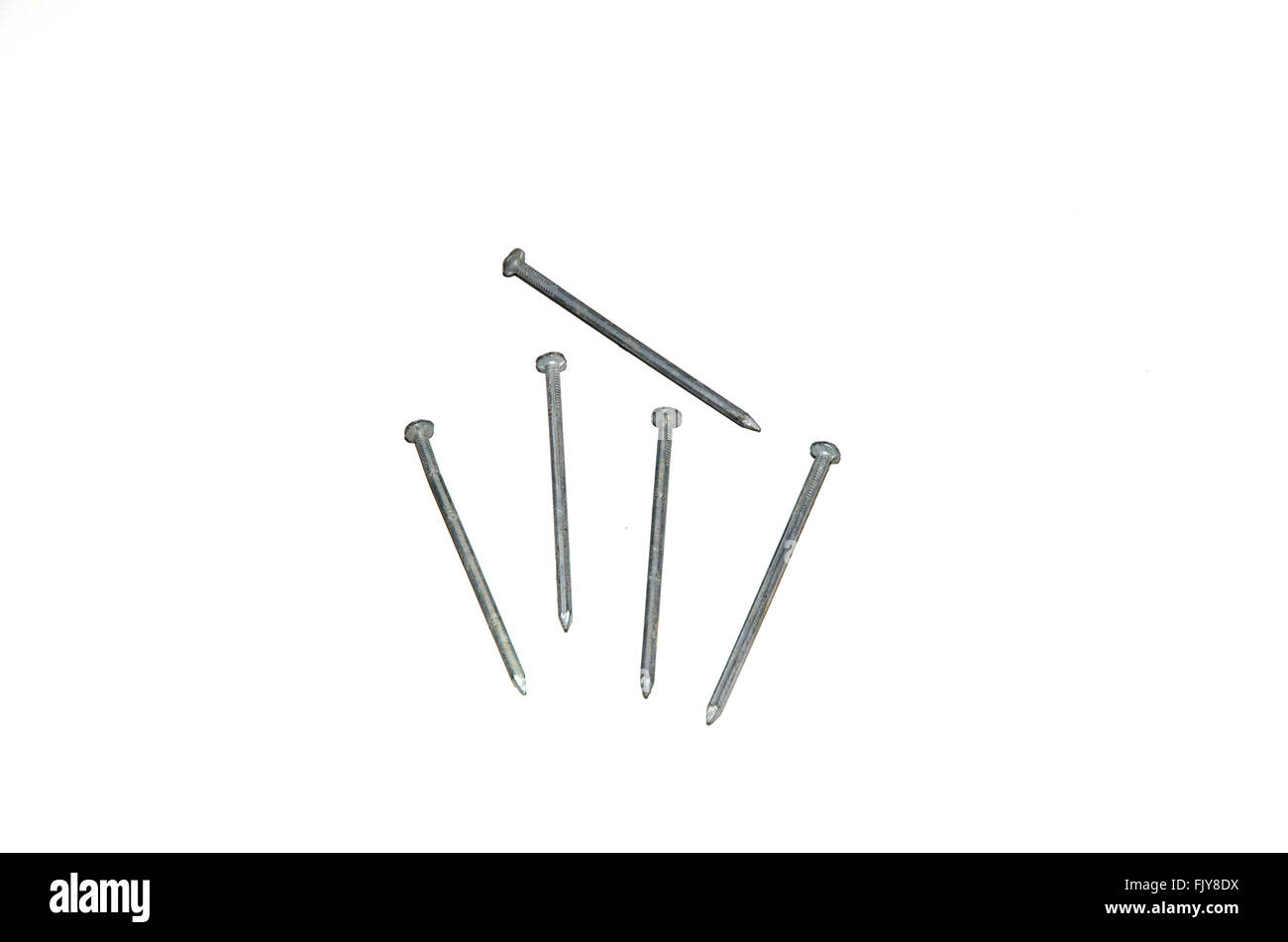 Group of nails at white background Stock Photo - Alamy