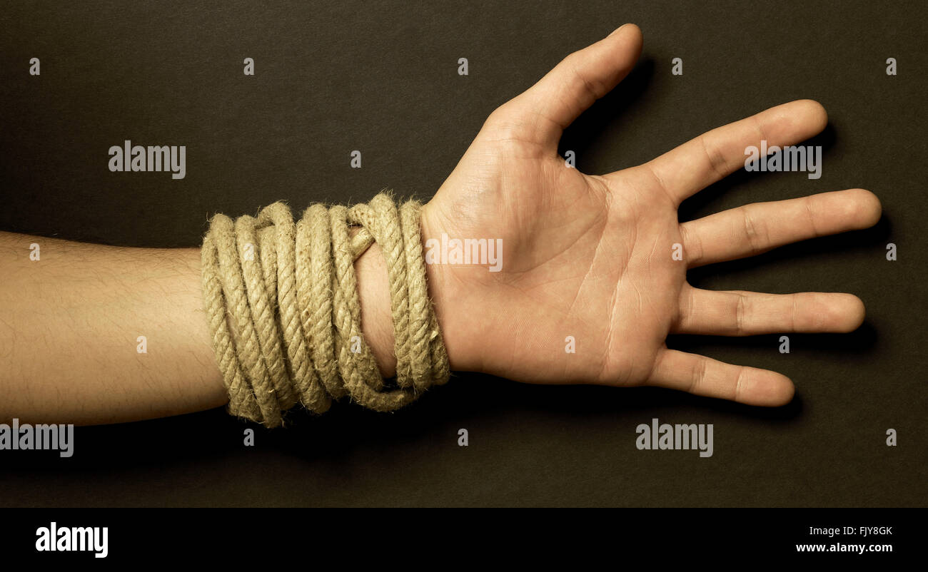 Hand with a rope with black background. Horizontal Stock Photo - Alamy