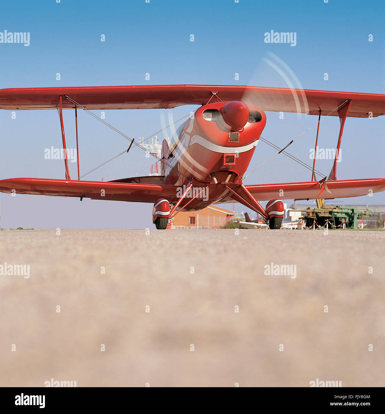 Red airplane ready to take off in an aerodrome Stock Photo - Alamy