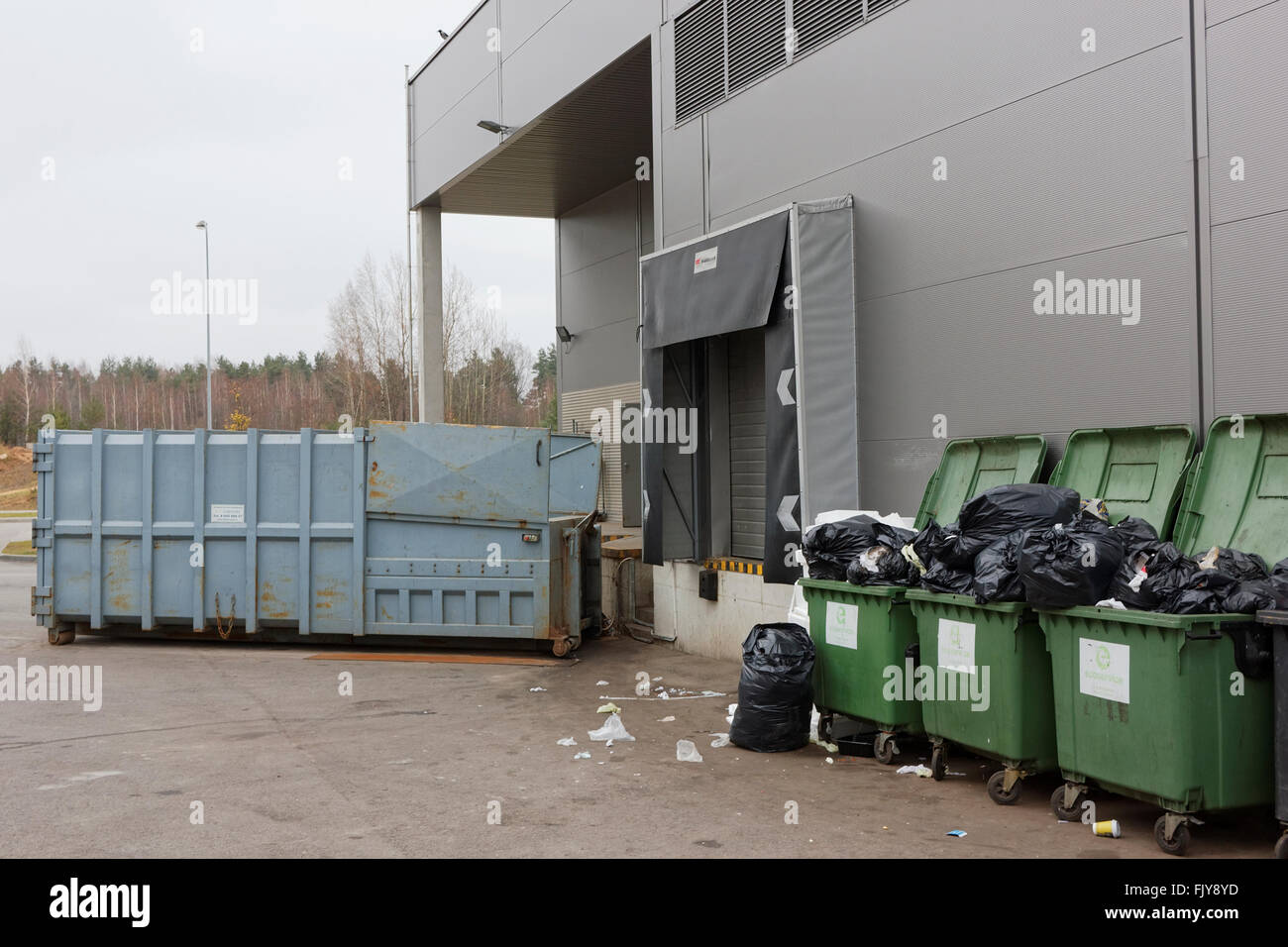 VILNIUS, LITHUANIA - FEBRUARY 13, 2016: Garbage dump and containers ...