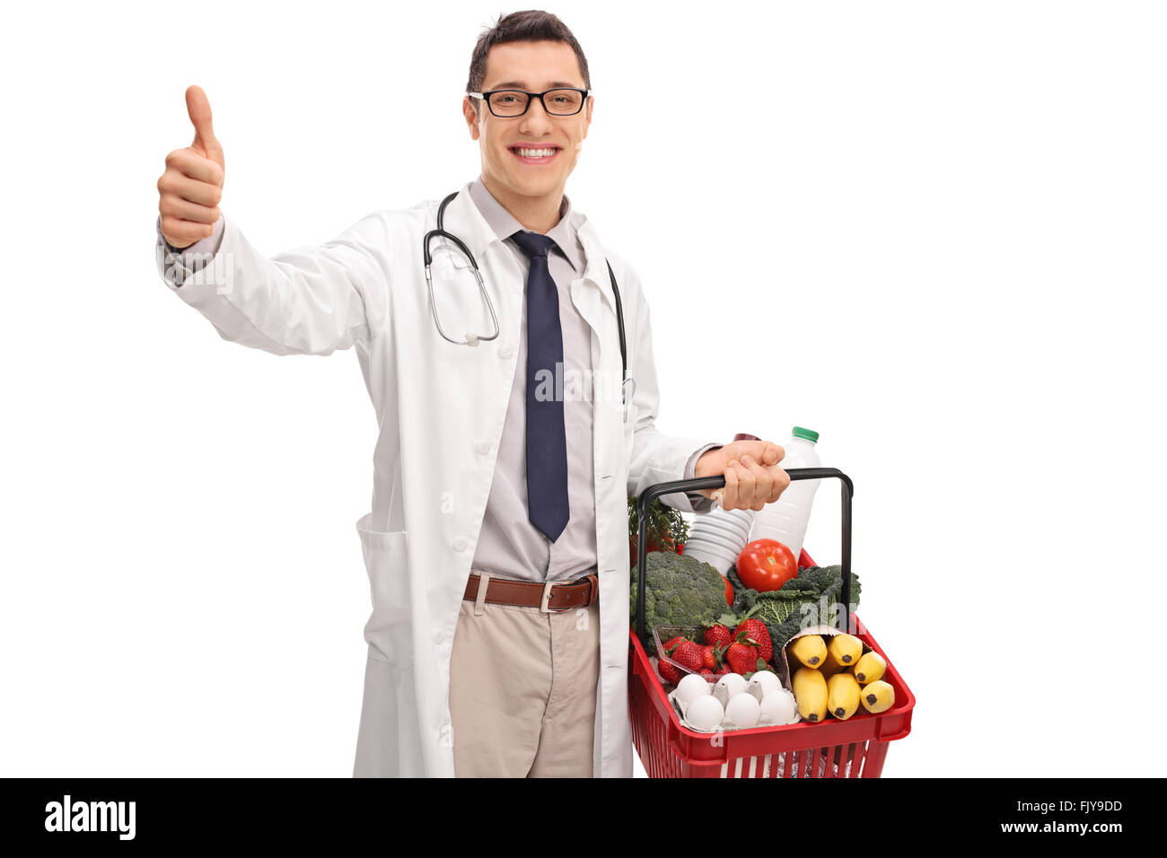 Cheerful doctor holding a shopping basket with groceries and giving a ...