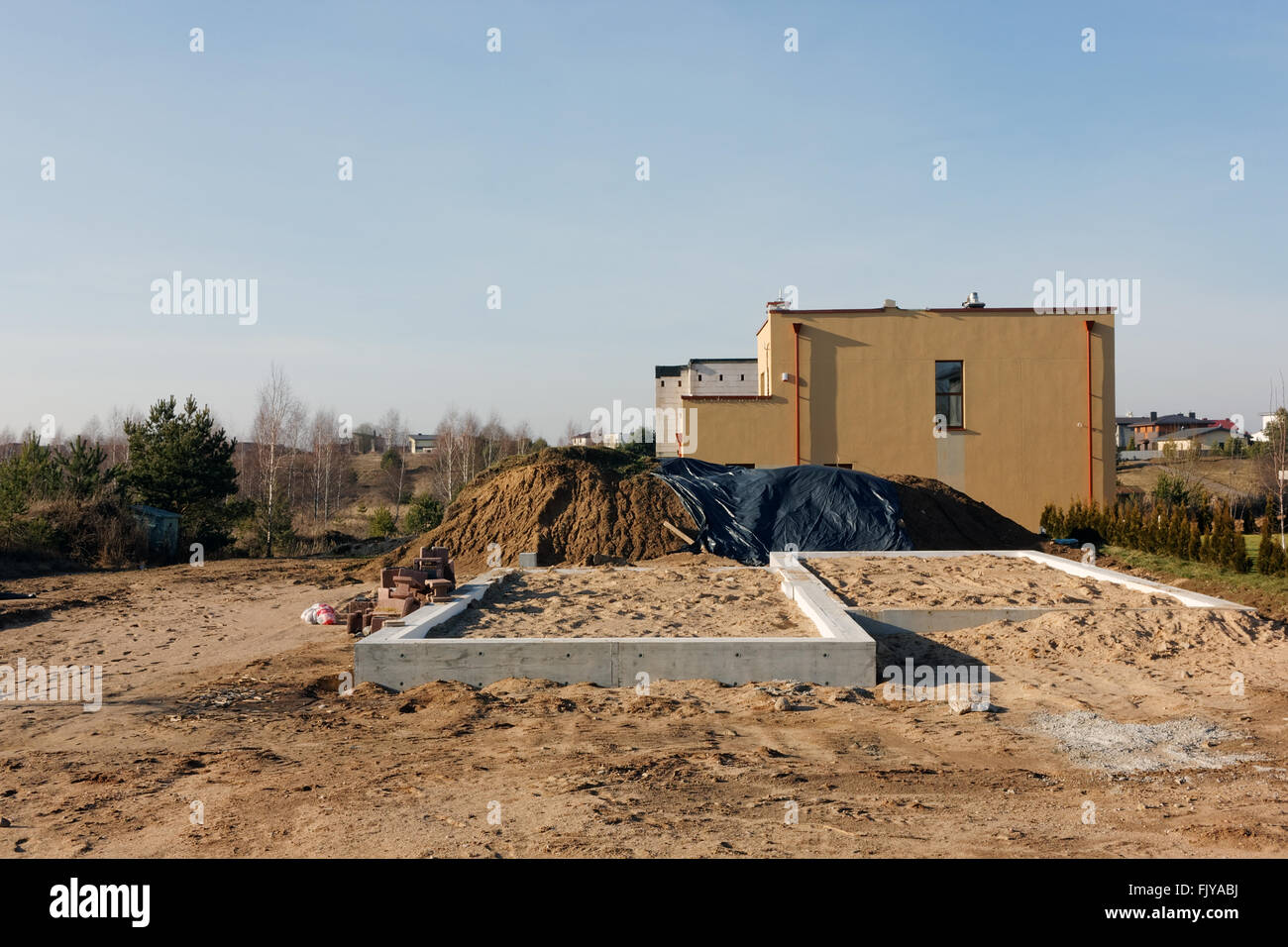 VILNIUS, LITHUANIA - FEBRUARY 07, 2016: Construction of yellow rustic ...