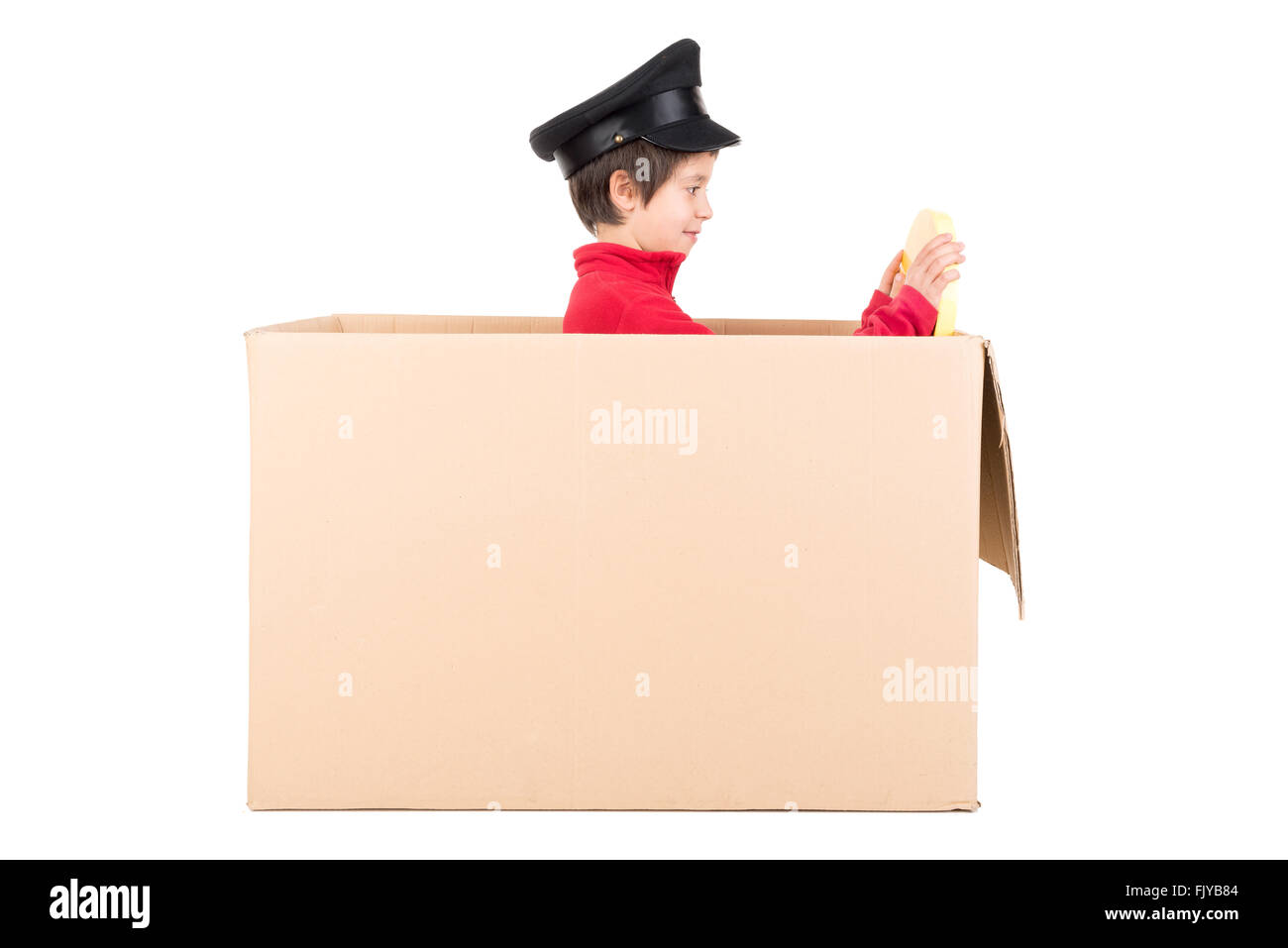 Young boy in a cardboard box playing taxi driver Stock Photo - Alamy