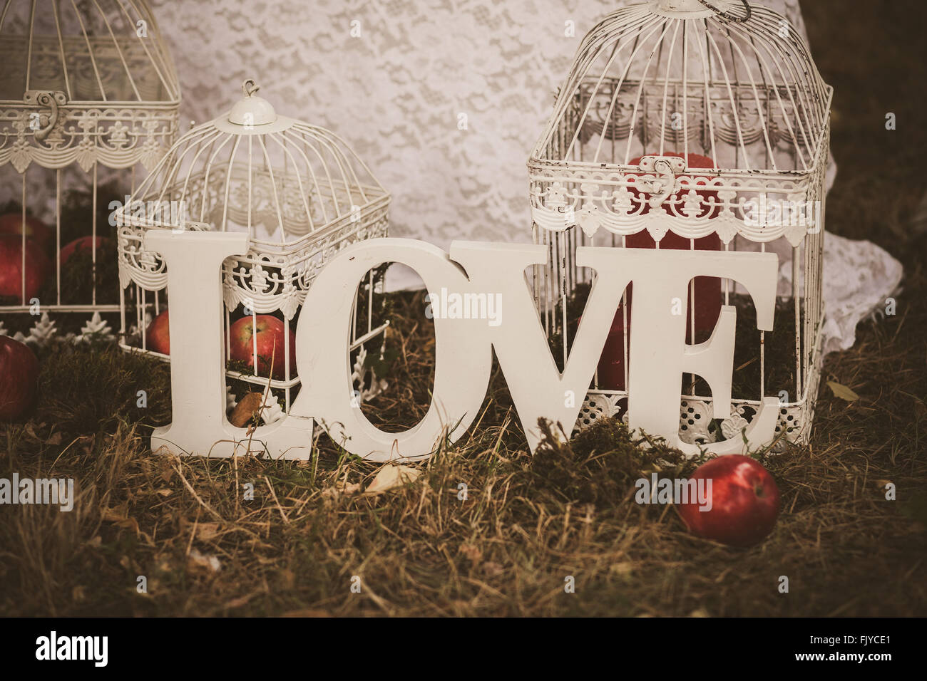 Love - wooden inscription for wedding. Wedding decor. Image toned in ...