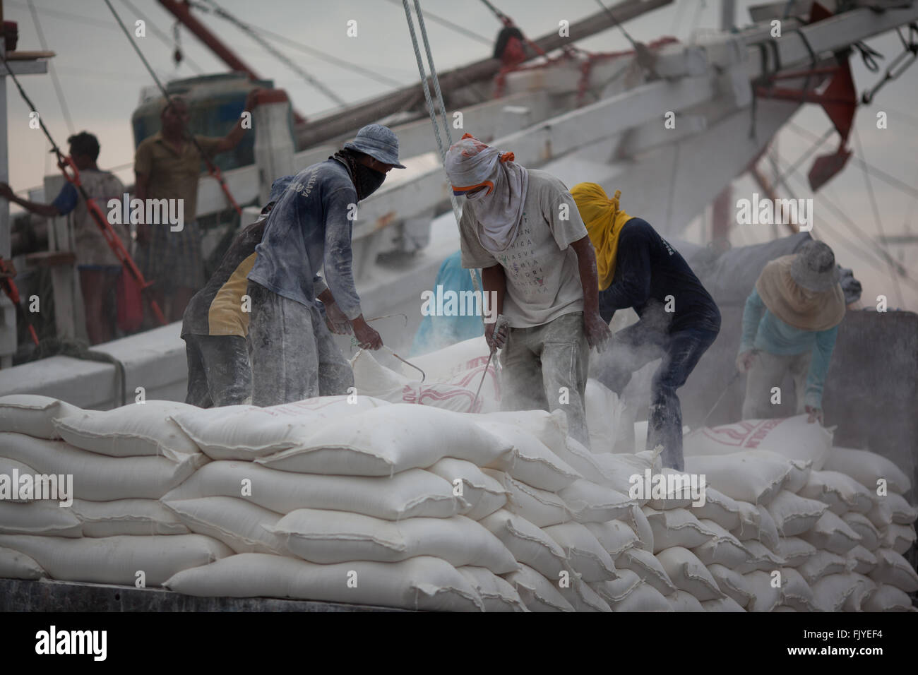 Men Unloading Cement Bags At Dockyard Stock Photo - Alamy