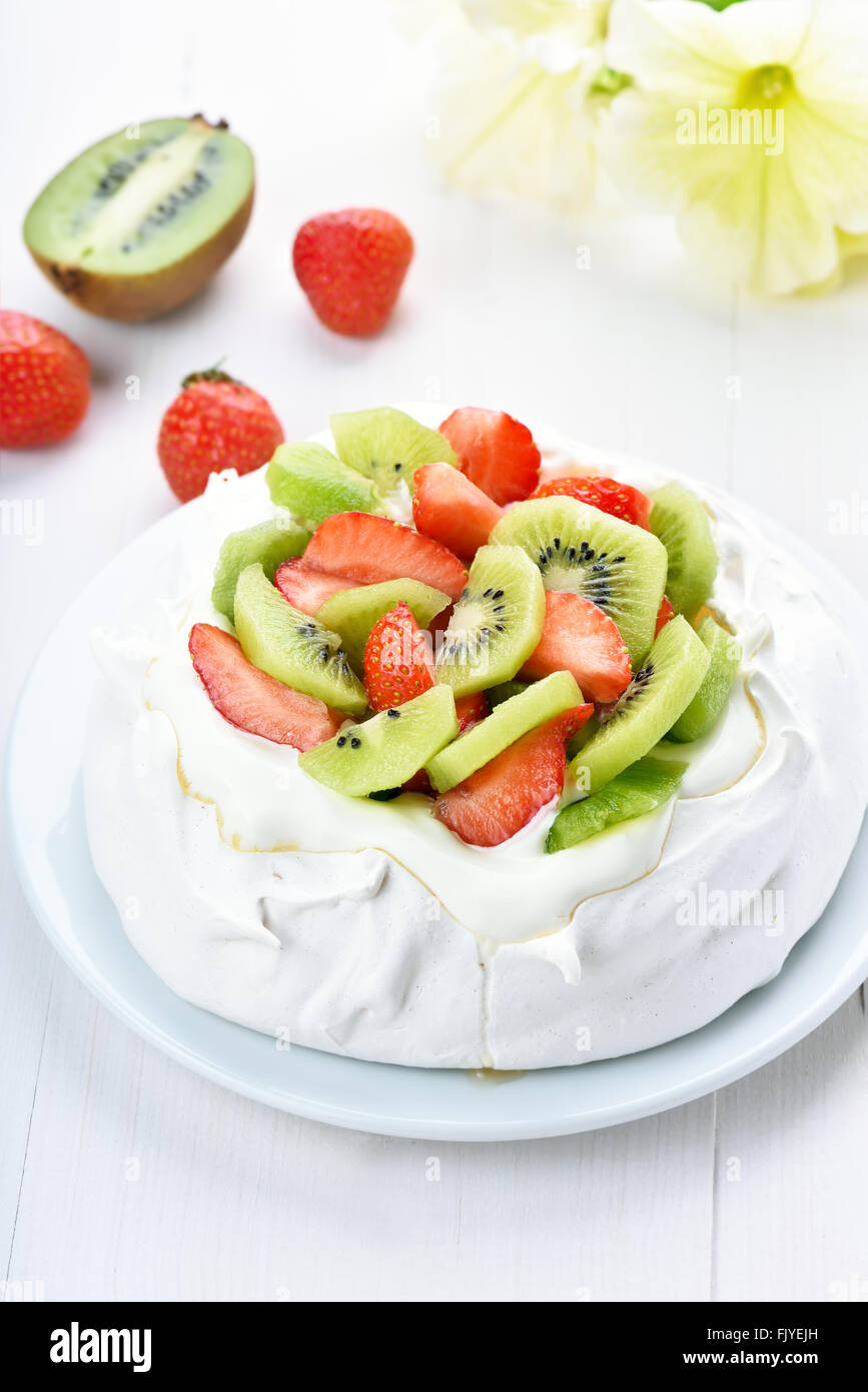 Pavlova meringue cake with strawberry and kiwi fruit slices Stock Photo ...