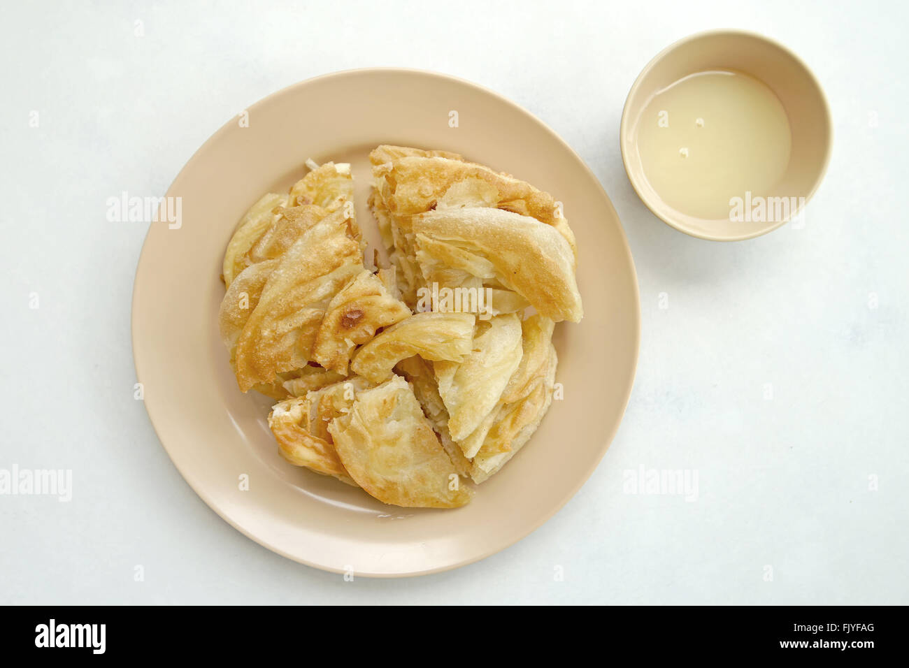 Indian sweet dessert roti with sweetened condensed milk Stock Photo - Alamy