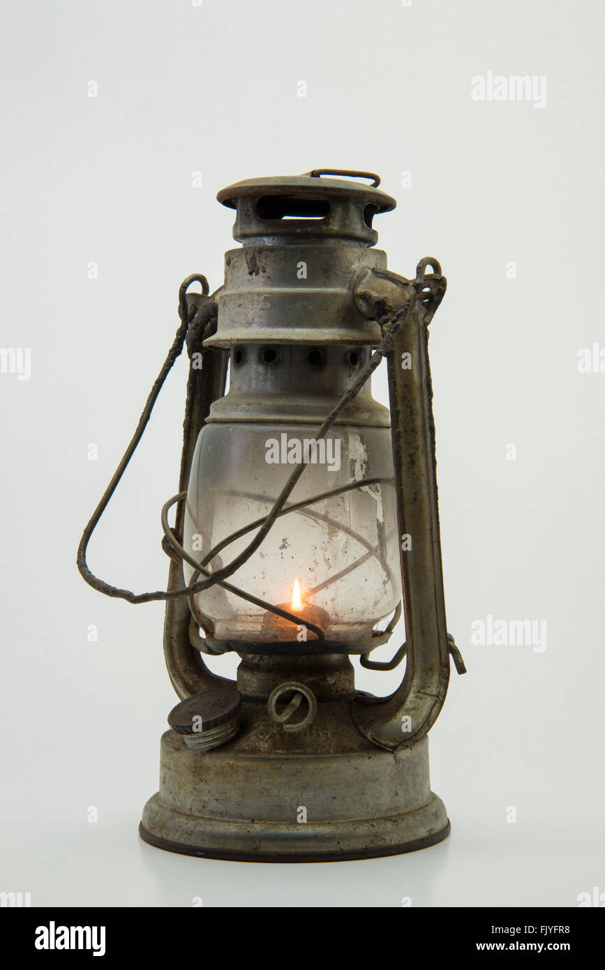 Old kerosene lamp isolated on white background Stock Photo - Alamy