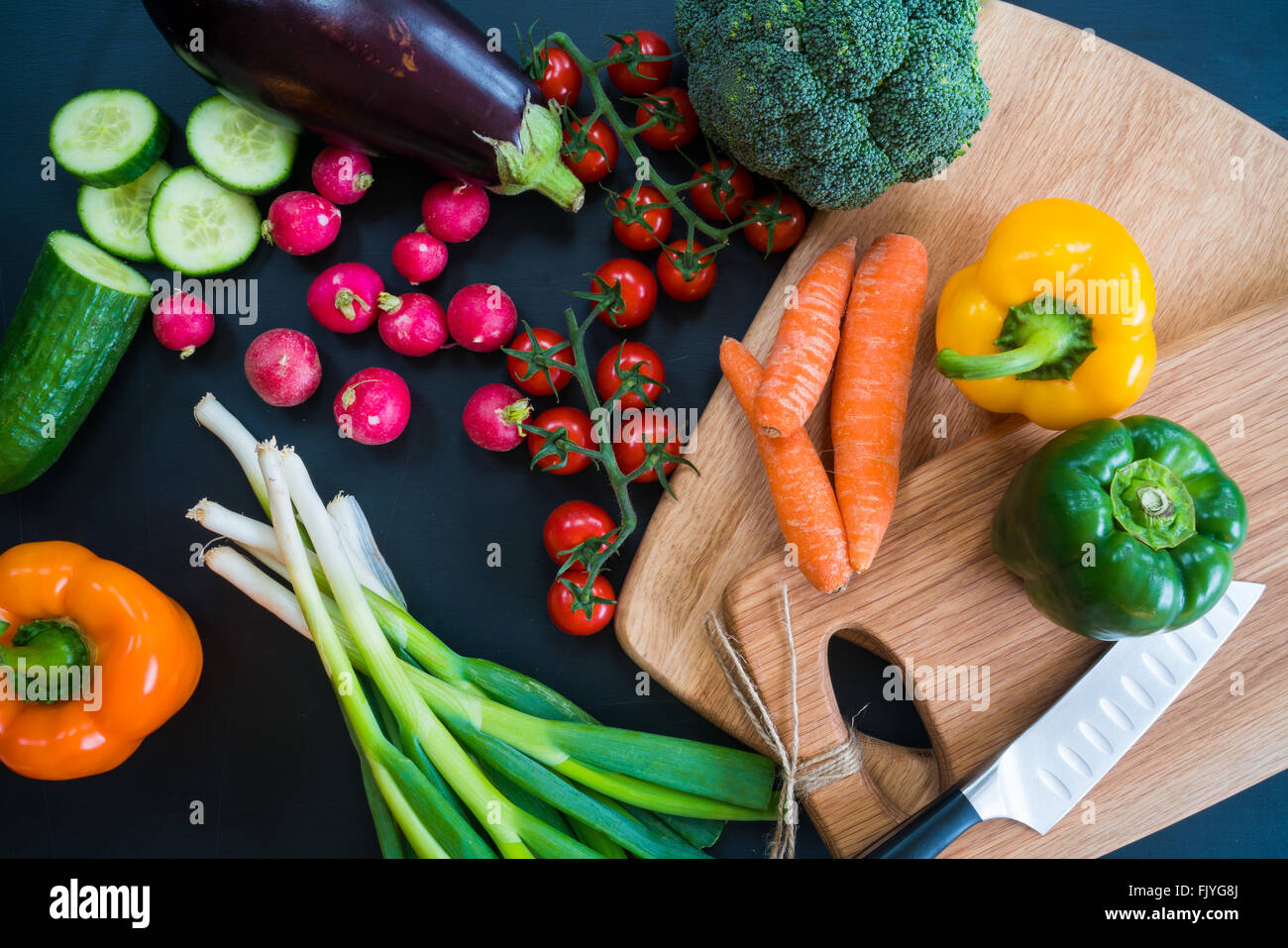 An overhead shot of various vegetables on chopping boards Stock Photo ...