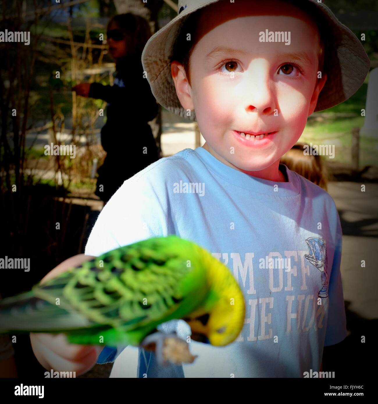 Boy playing with a bird hi-res stock photography and images - Alamy