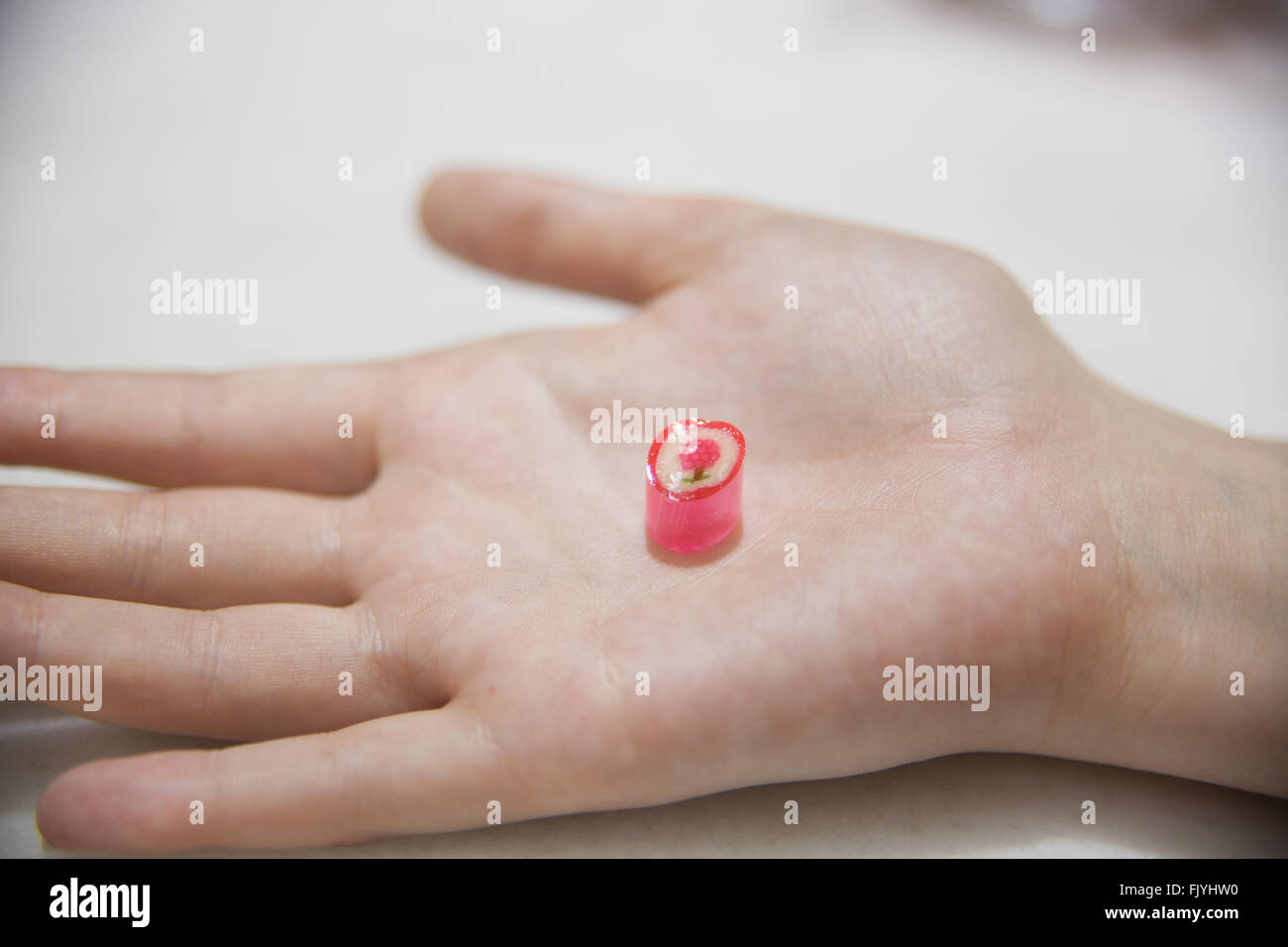 Candy in hand hi-res stock photography and images - Alamy