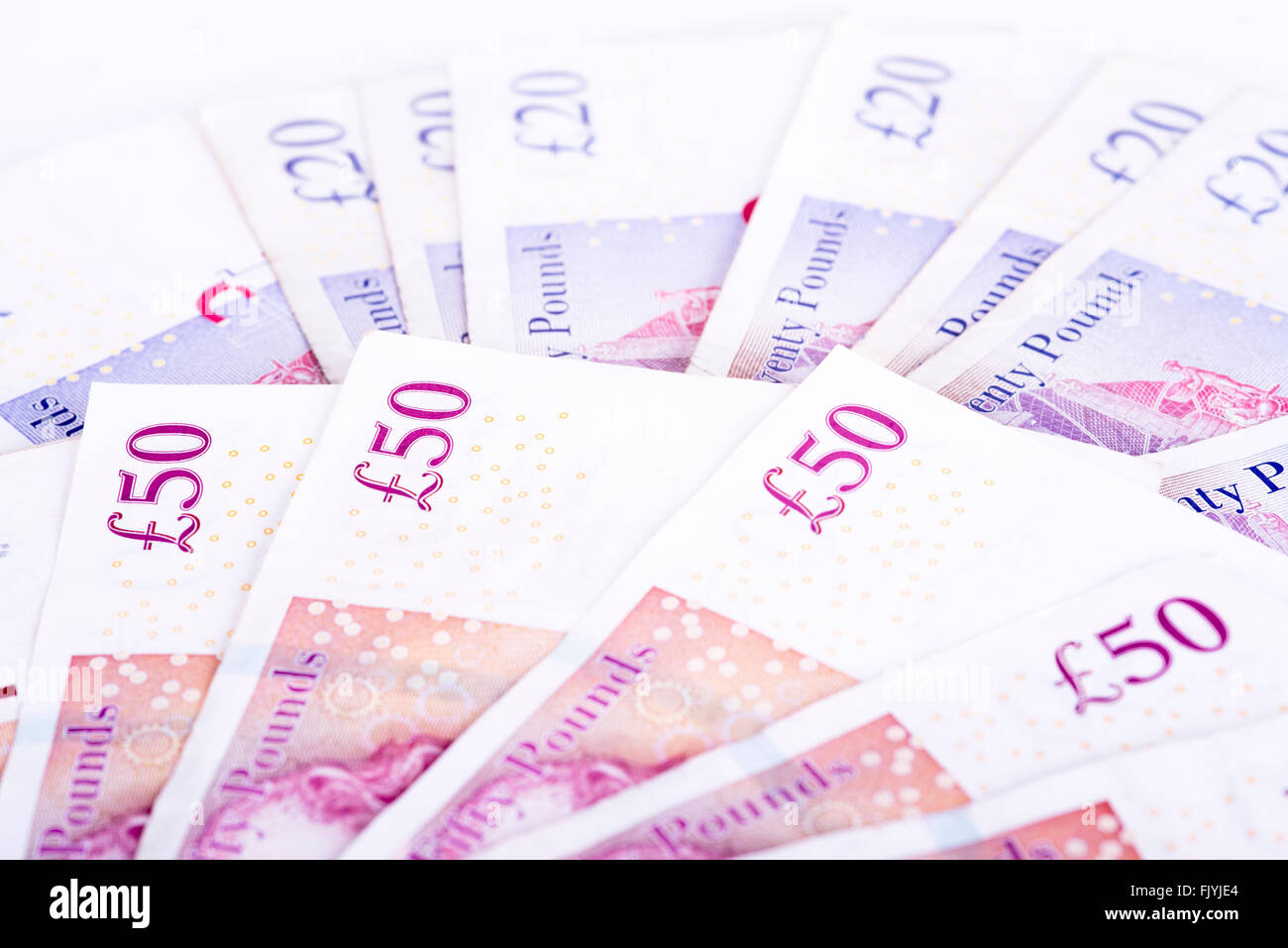 pictures of pounds banknotes on a white background Stock Photo - Alamy