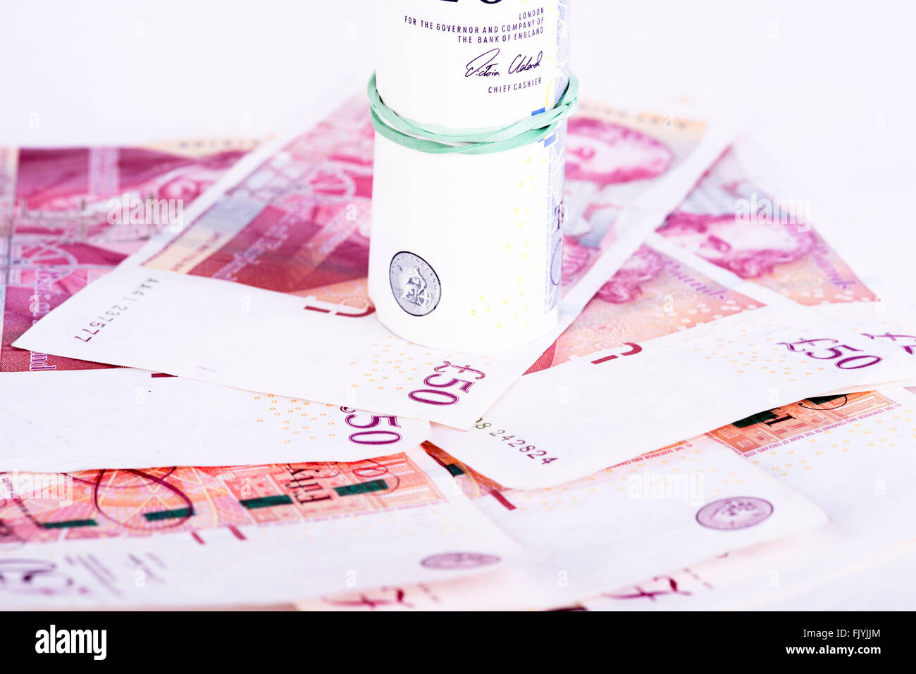 pictures of pounds banknotes on a white background Stock Photo - Alamy