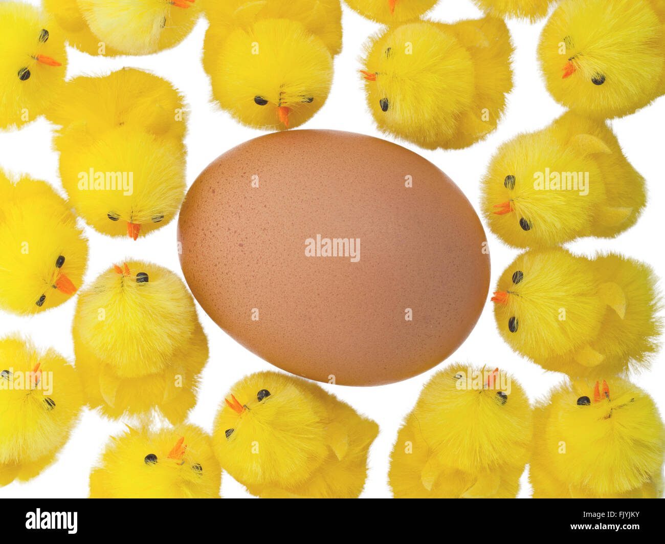 Easter chicks surrounding a large egg, isolated Stock Photo - Alamy