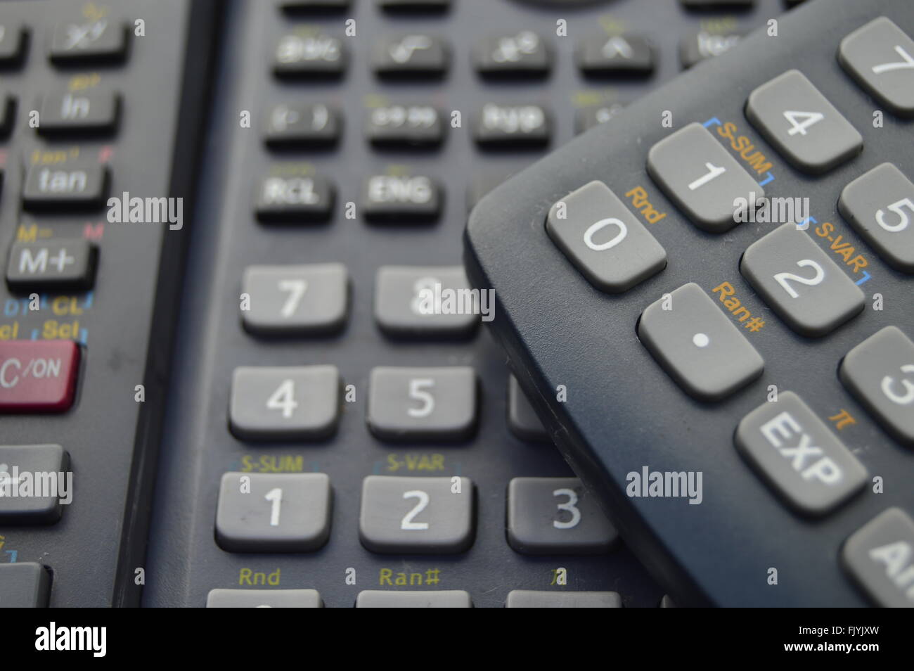 Electronic scientific calculators background Stock Photo - Alamy
