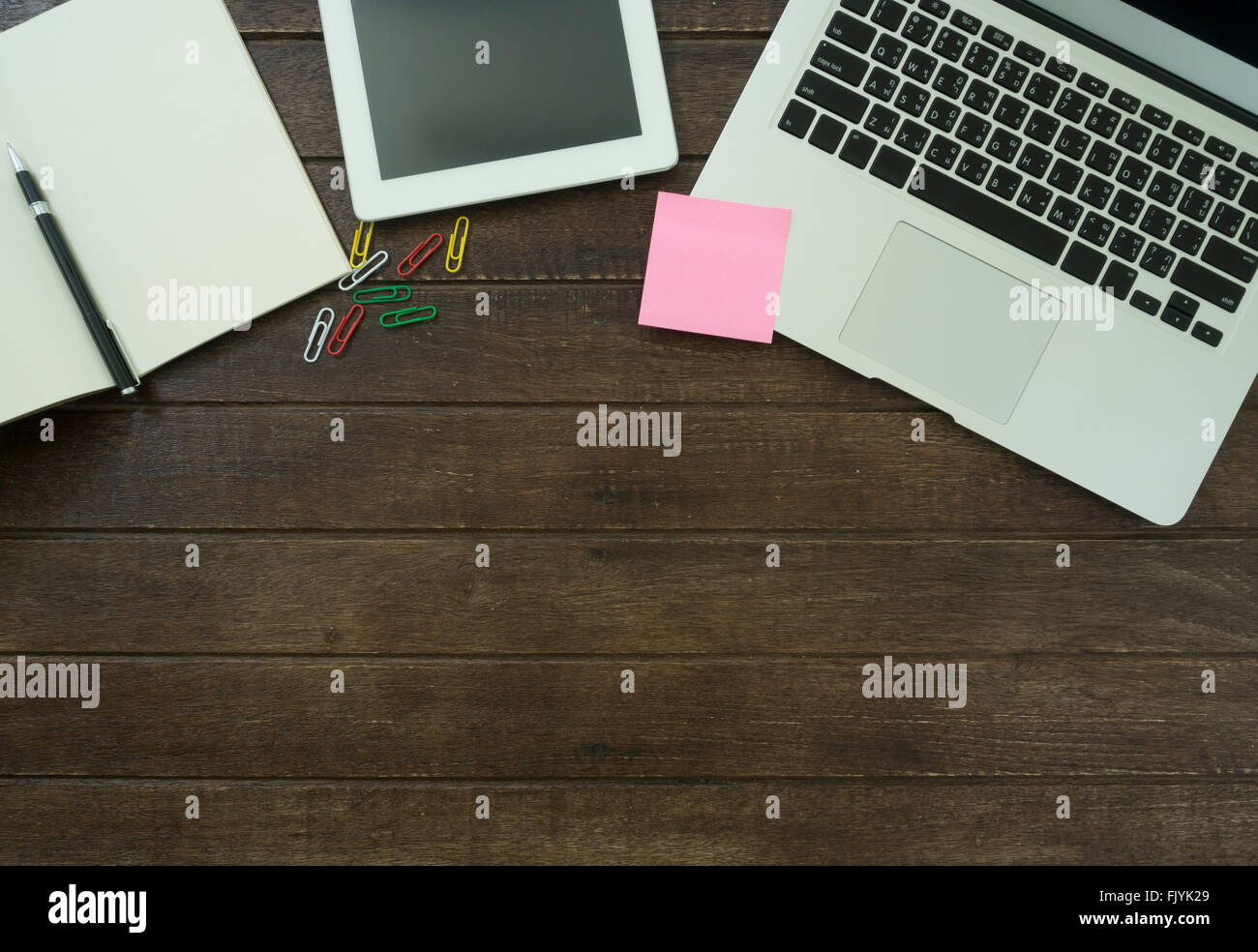 book ,notebook, laptop ,pen on wooden table Stock Photo - Alamy