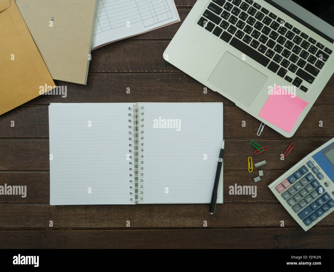 notebook, laptop,Calculator on desk. working concept Stock Photo - Alamy